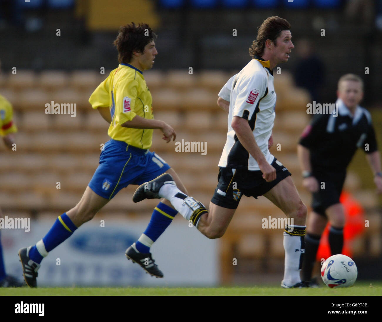 Port Vale's Danny Sonner gets away from Colchester's Kemizzet Stock ...