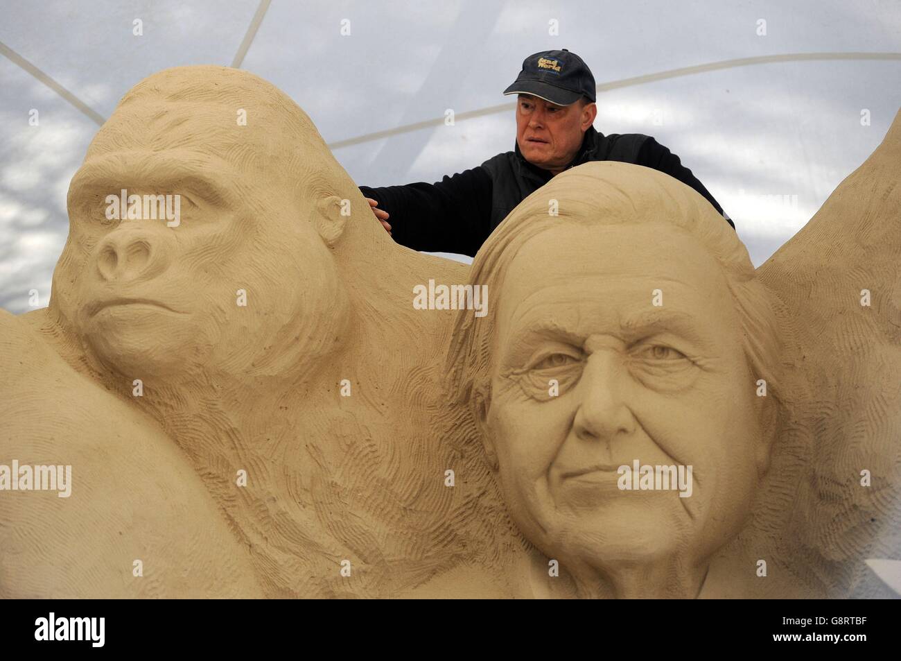 Mark Anderson, co-founder of Sandworld, inspects the sculpture 'The ...