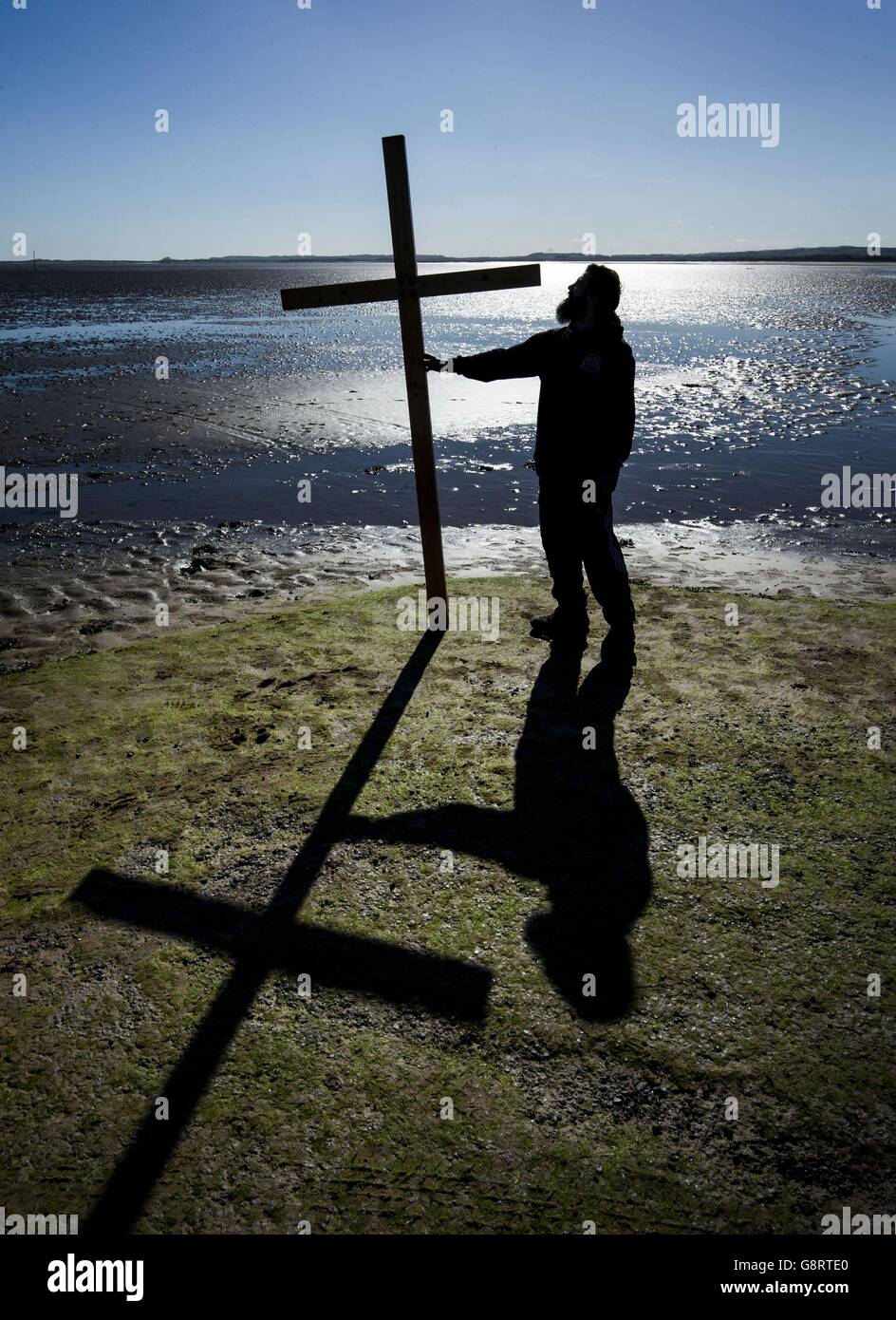 A pilgrim with a cross on the final leg of the Northern Cross ...