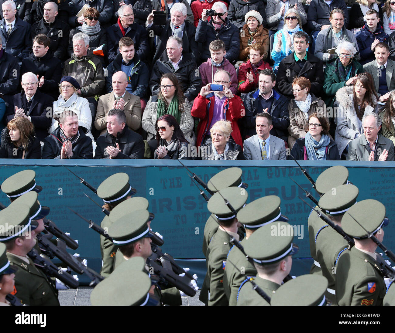 Members of the public watch as soldiers from the Irish Defence Force ...