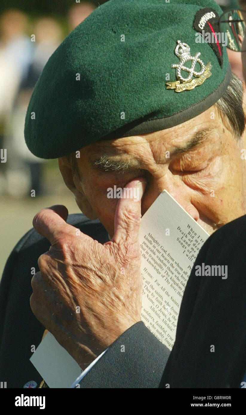 A veteran member of the Commando Association watches the Royal Marines ...