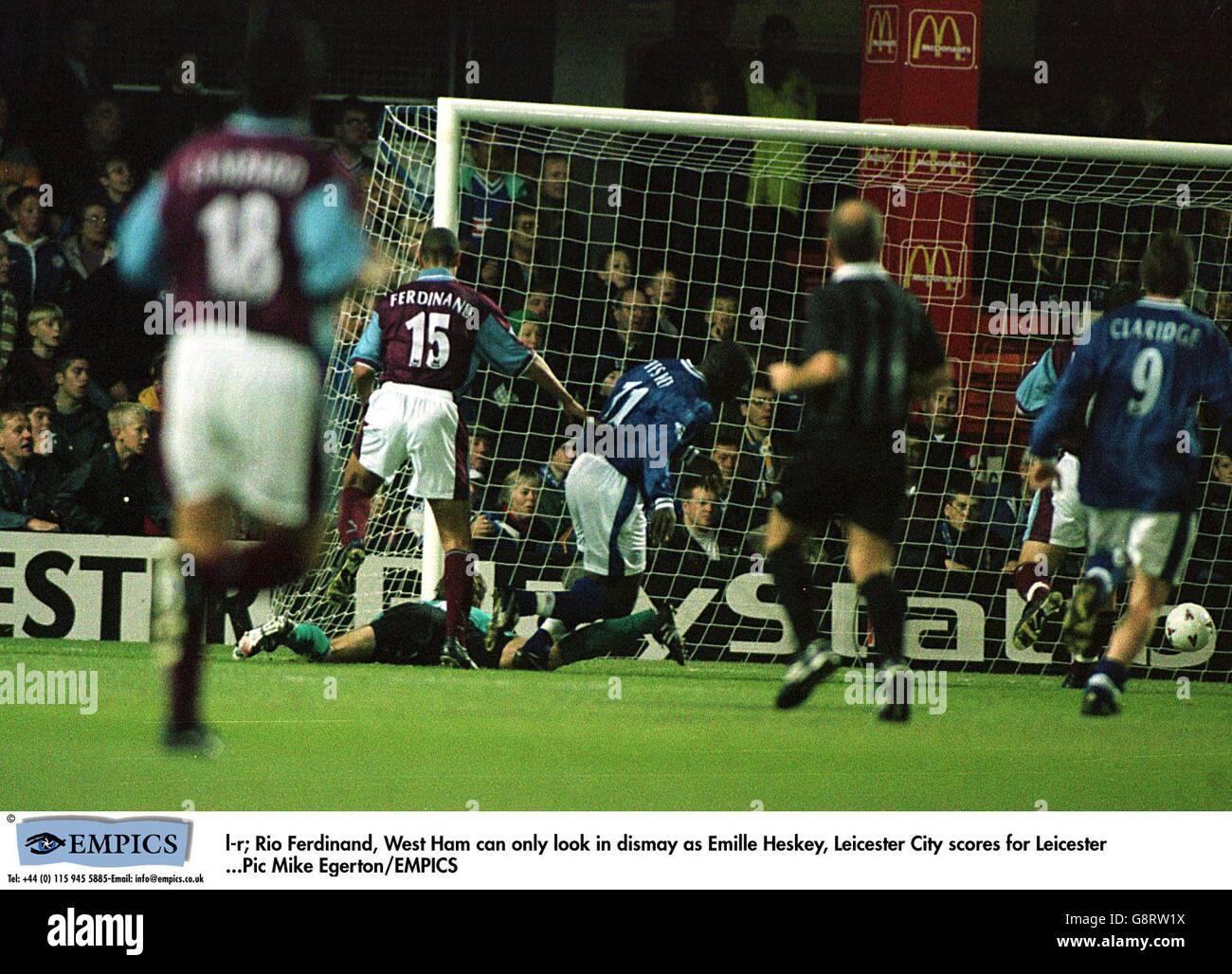 Rio Ferdinand of West Ham United (left) arrives too late to stop Emile ...