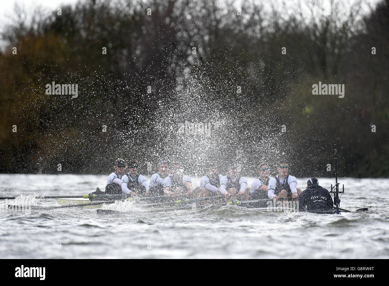 Oxford Men's Blue Boat crew race through choppy waters during the Men's ...
