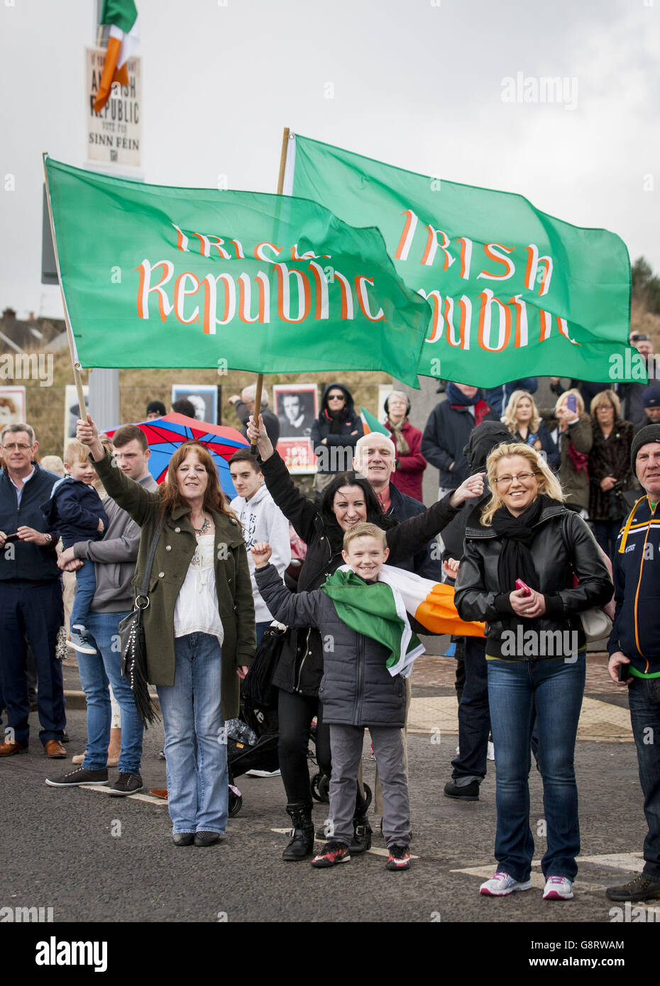 People wave flags during the Sinn Fein commemoration parade marking the ...