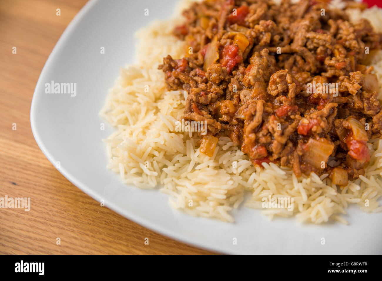 A plate of chilli con carne on a dinner table Stock Photo - Alamy