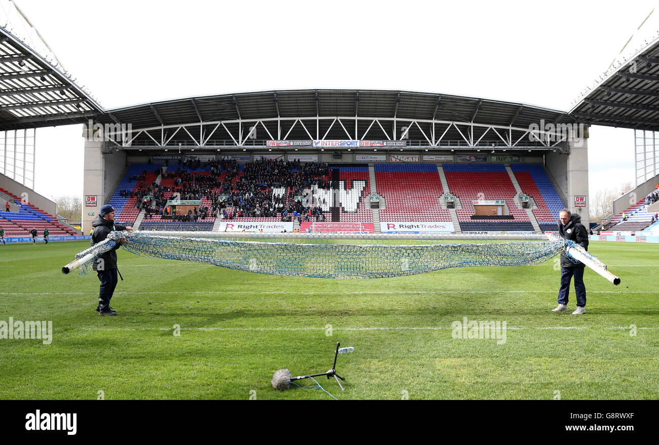 Ground staff remove the goal posts and put up Rugby posts before ...
