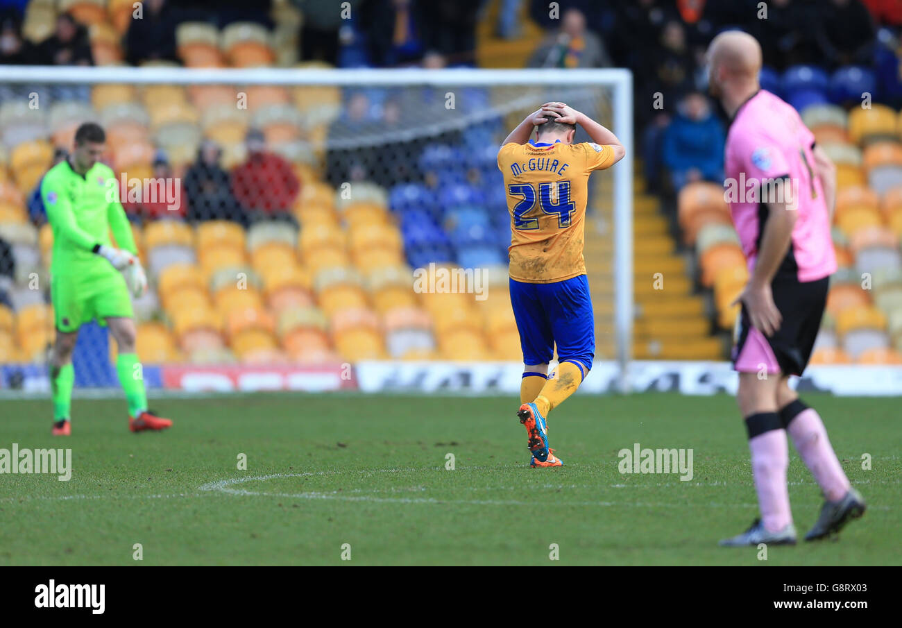 Mansfield Town's Jamie McGuire (Number 24) leaves the field after being ...