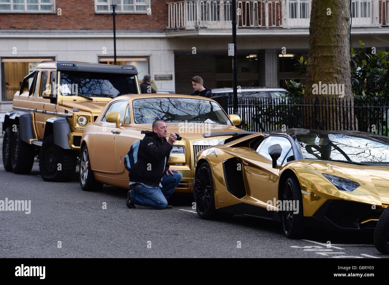 Three gold cars from Saudi Arabia (left-right) a 6x6 Mercedes G 63 ...