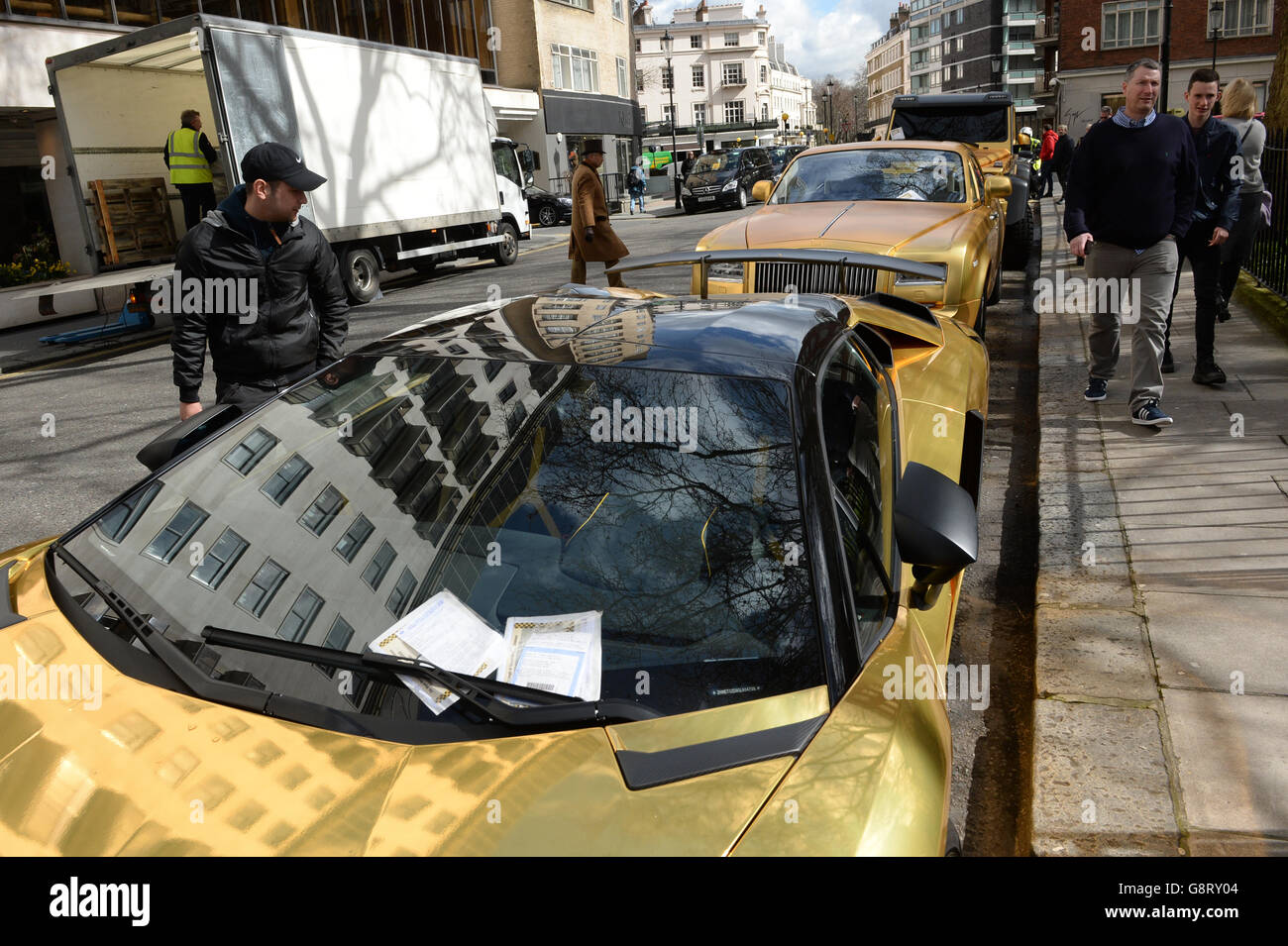 Three gold cars from Saudi Arabia (back-front) a 6x6 Mercedes G 63 ...