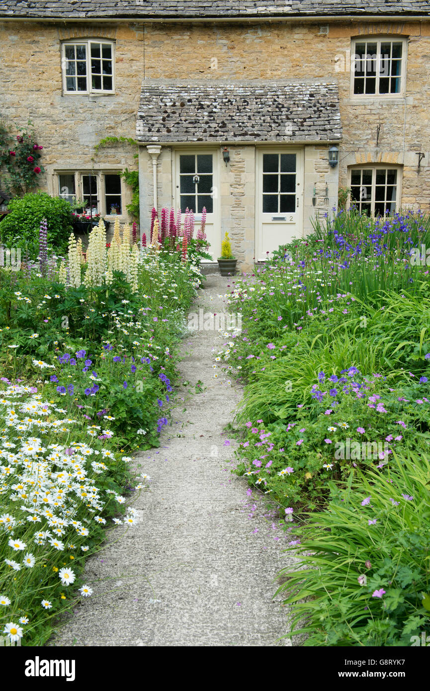 Cottage and garden in spring. Upper Slaughter, Cotswolds ...