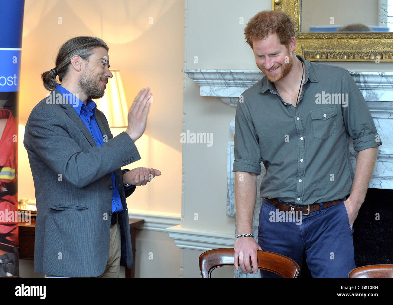 Prince Harry, royal patron of MapAction, speaks with volunteer Hamish ...