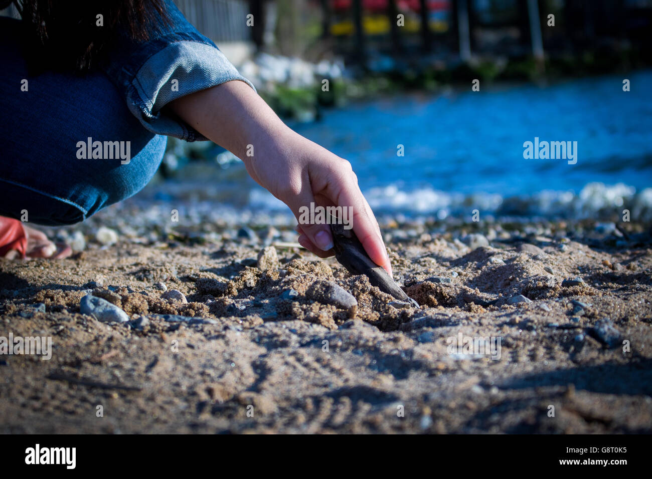 Girl writing in the sand hi-res stock photography and images - Alamy