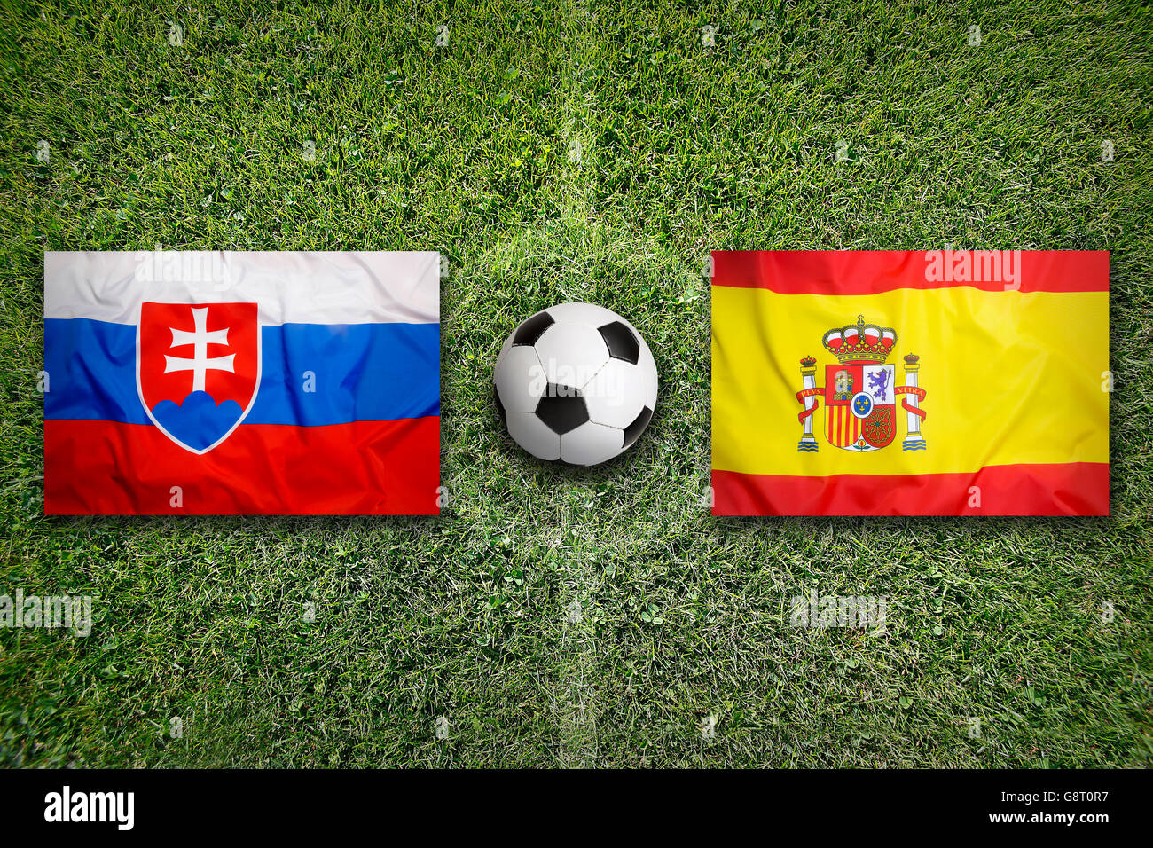 Slovakia vs. Spain flags on green soccer field Stock Photo - Alamy