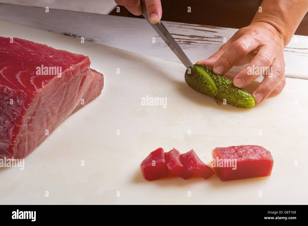 Hand with knife cuts cucumber Stock Photo - Alamy