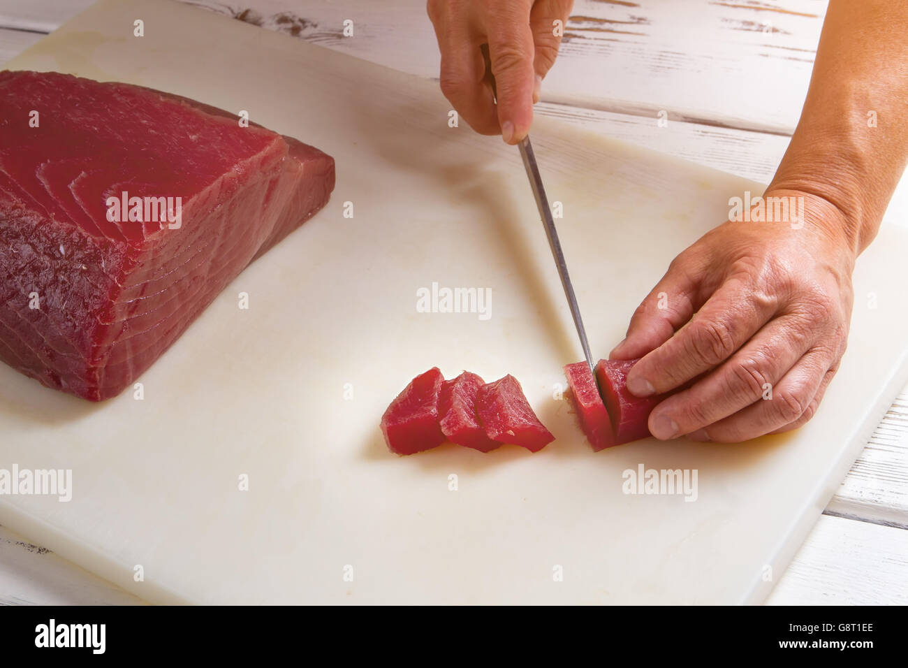 Chef cuts raw red meat hi-res stock photography and images - Alamy
