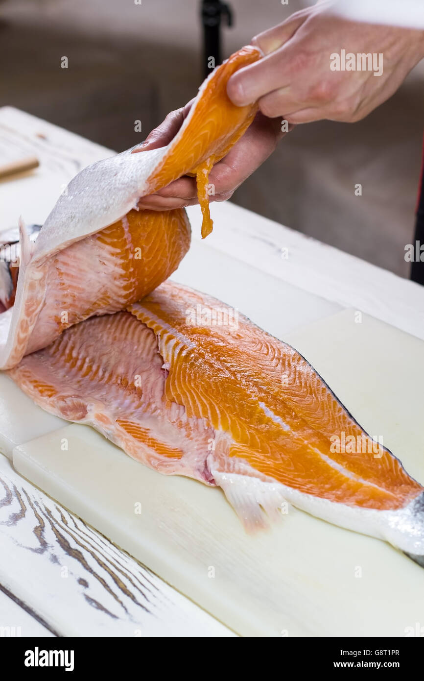 Male hands touch fish meat Stock Photo - Alamy