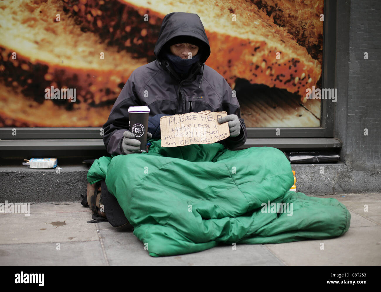 Homeless Person With Blank Sign