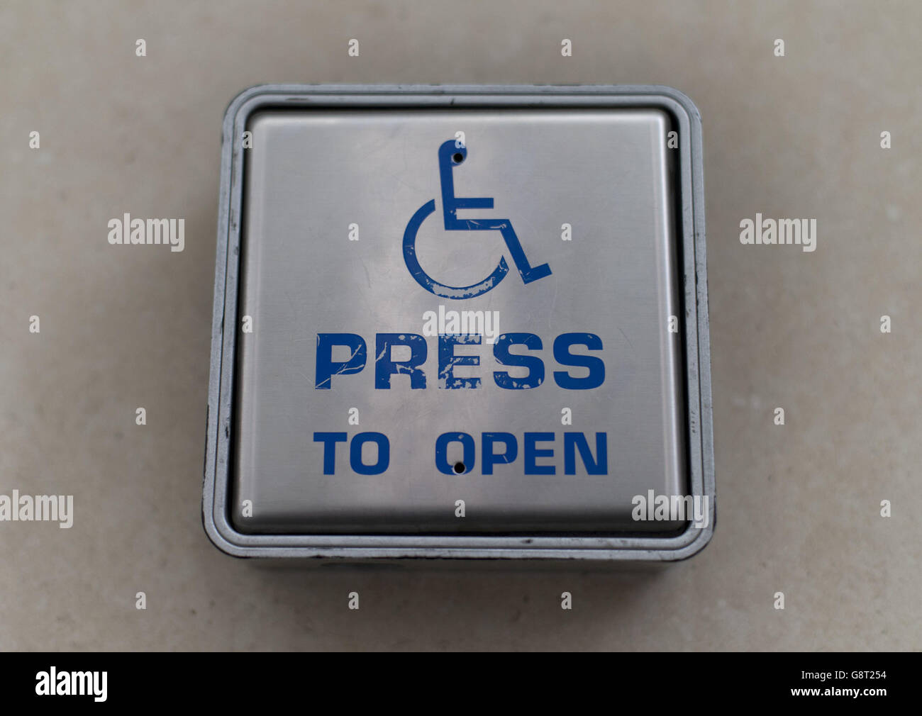 A wheelchair access door entry button on a building in Victoria, London ...