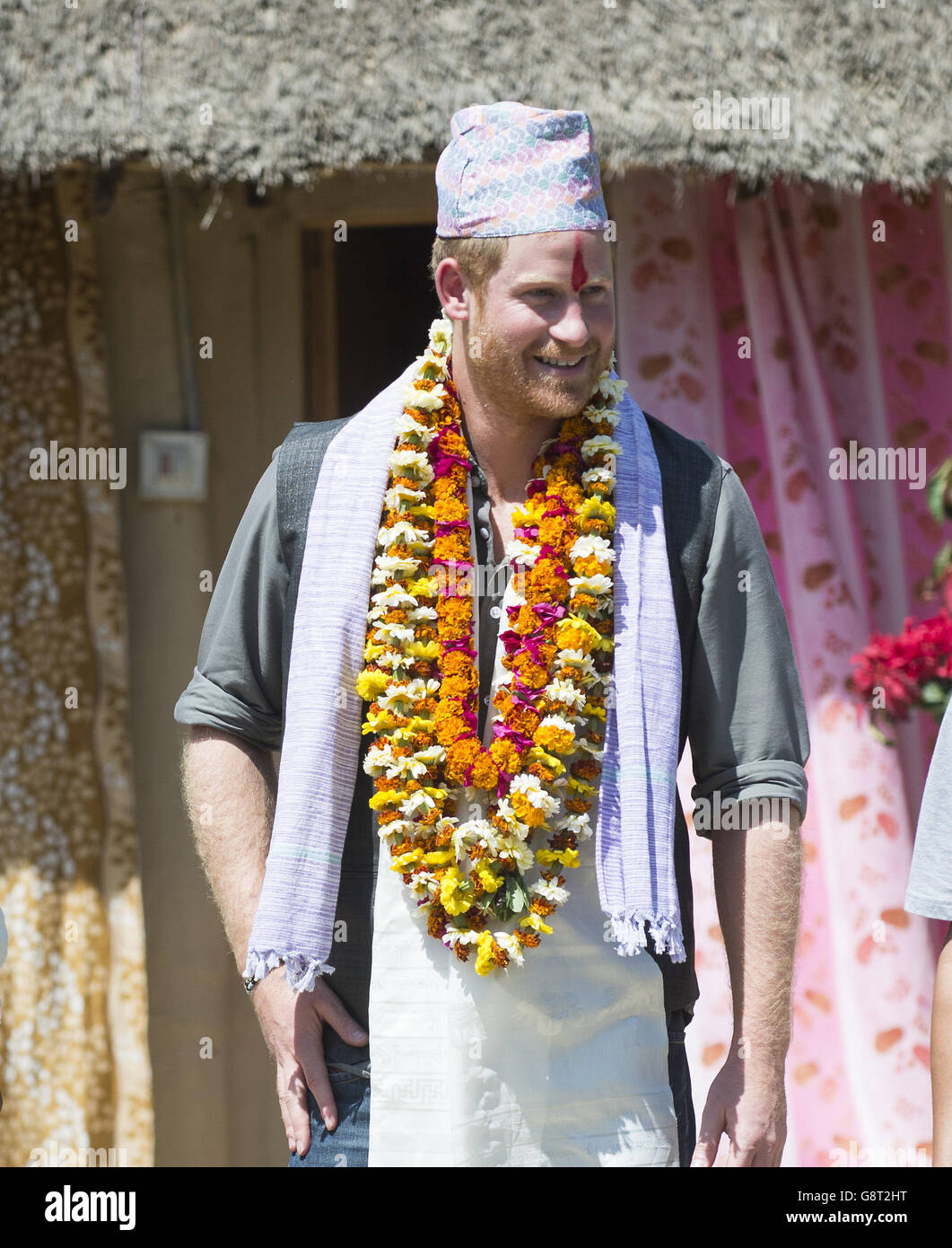 Prince Harry is given a Topi, a traditional Nepalese hat, at Danna ...