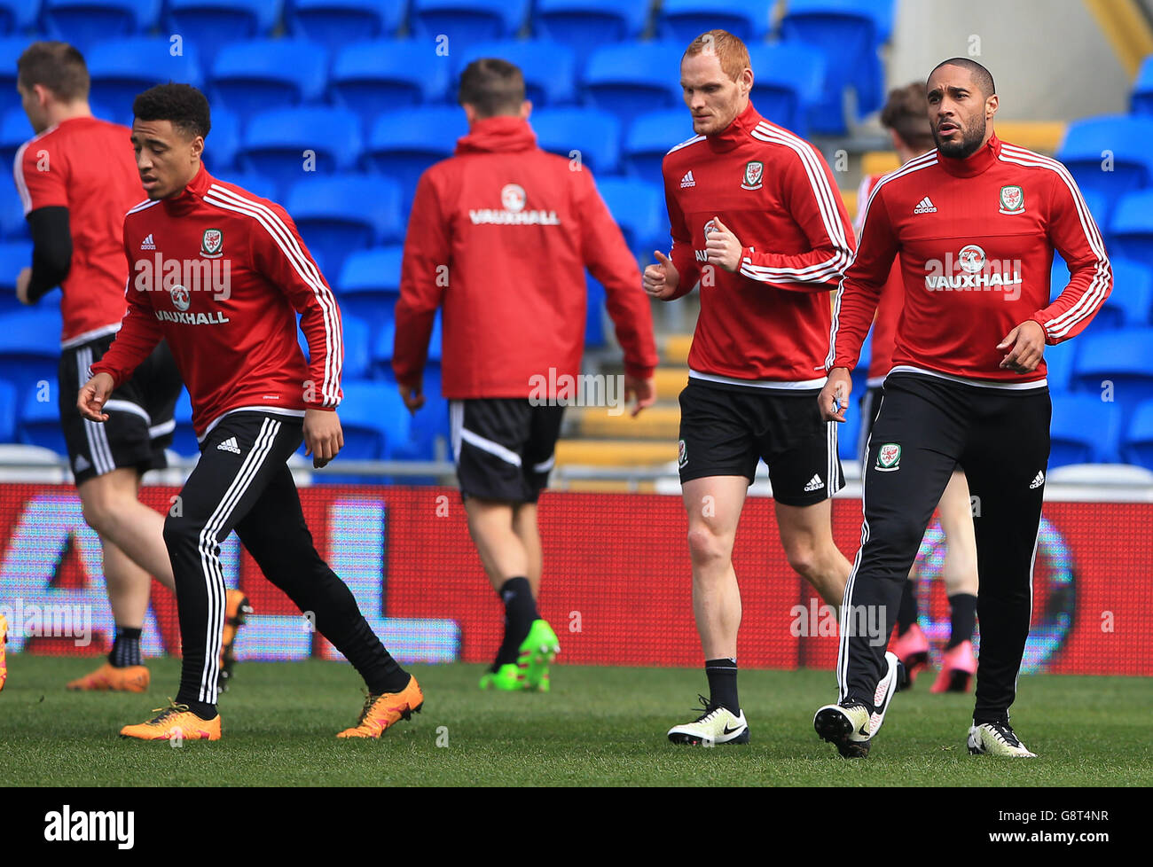Wales captain Ashley Williams (right) warms up with team-mates Shaun ...
