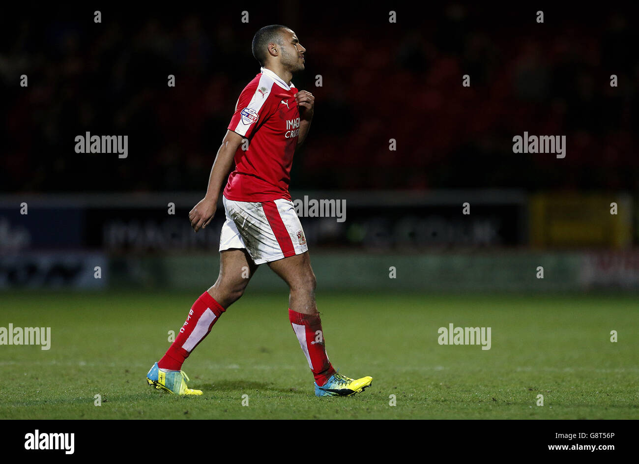 Swindon Town's Nathan Thompson walks off the pitch after being shown a ...