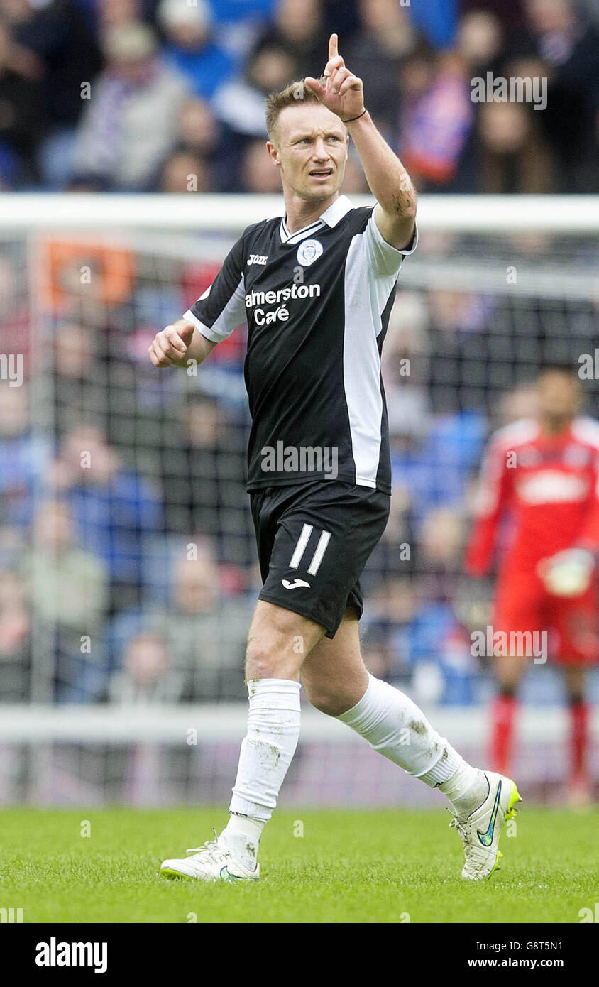 Queen of the South's Iain Russell celebrates from the penalty spot ...