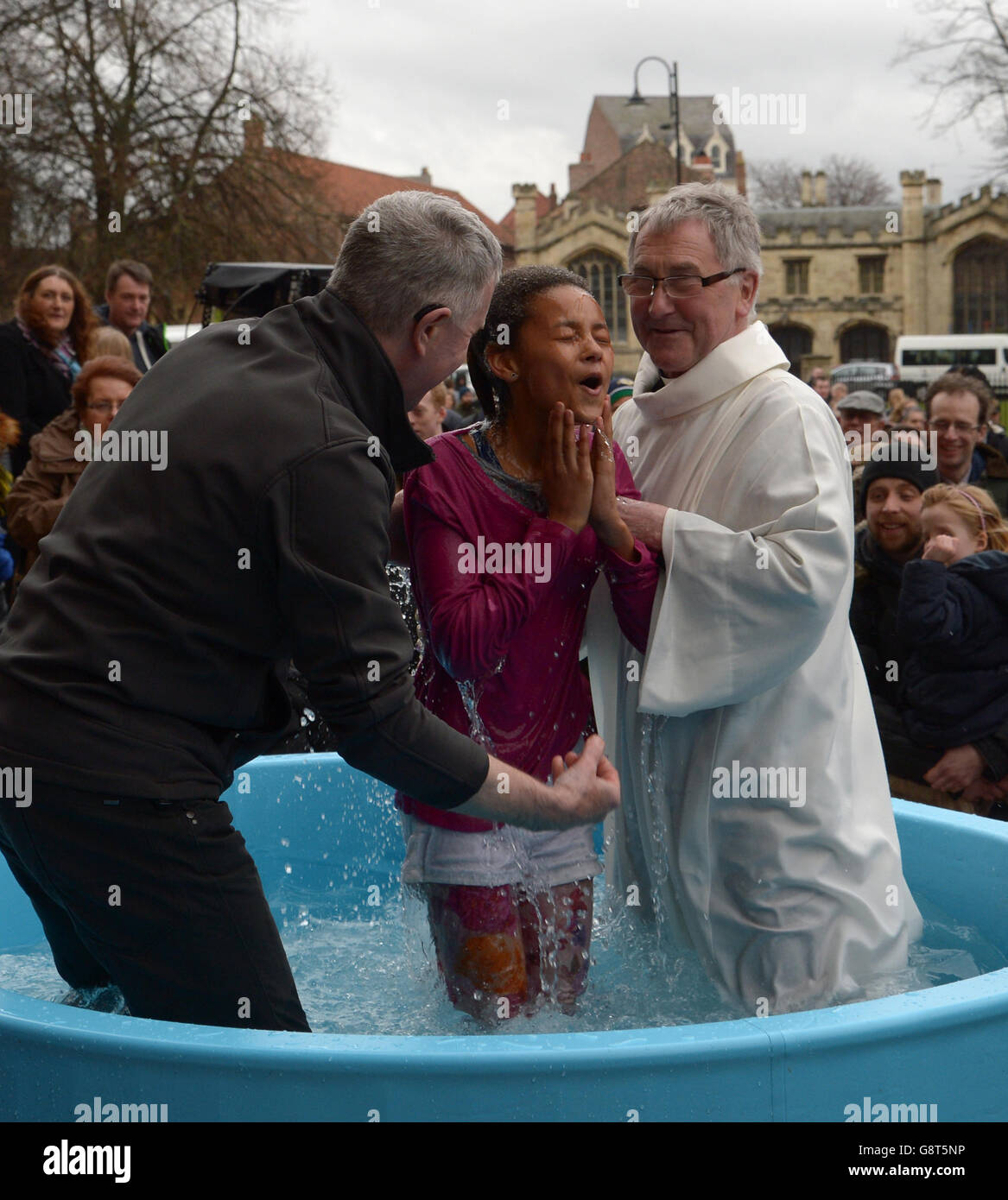 The Bishop of Beverley, the Rt Rev Glyn Webster (right) baptises Cherie ...