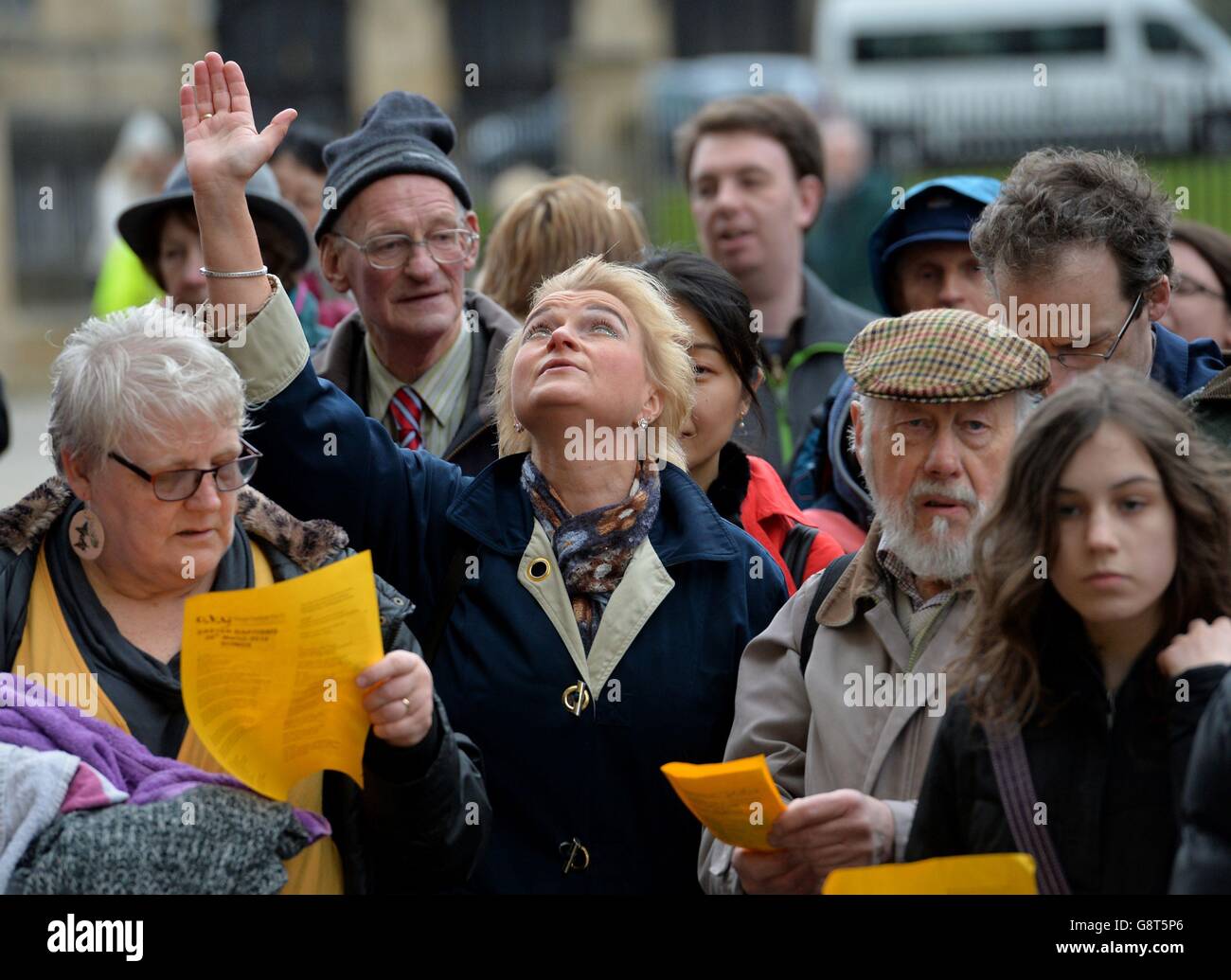 Members of the crowd sing along during the Easter open air baptisms at ...