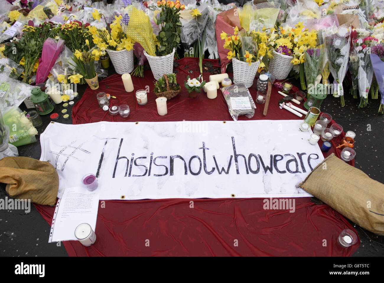 Tributes left to Asad Shah outside his shop in Shawlands Glasgow, as a ...
