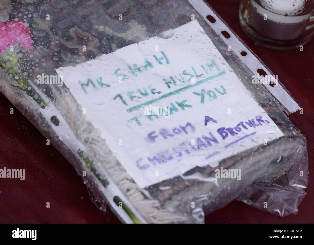 Tributes left to asad shah outside his shop in shawlands hi-res stock ...