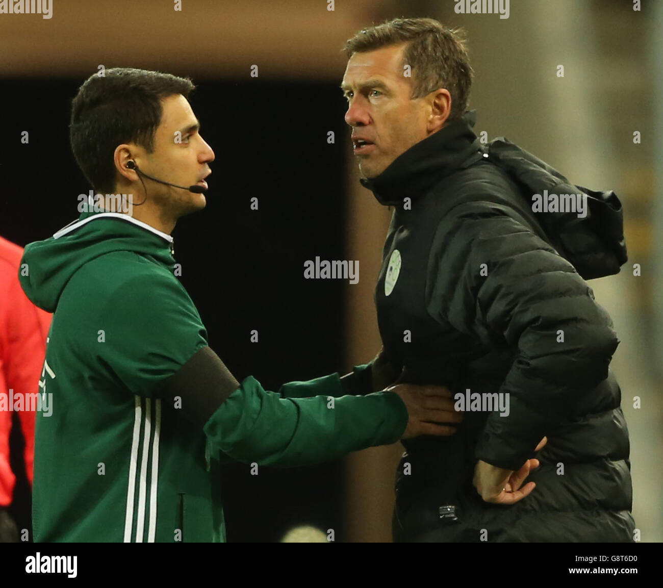 Slovenia's manager Katanec Srecko speaks with the fourth official ...