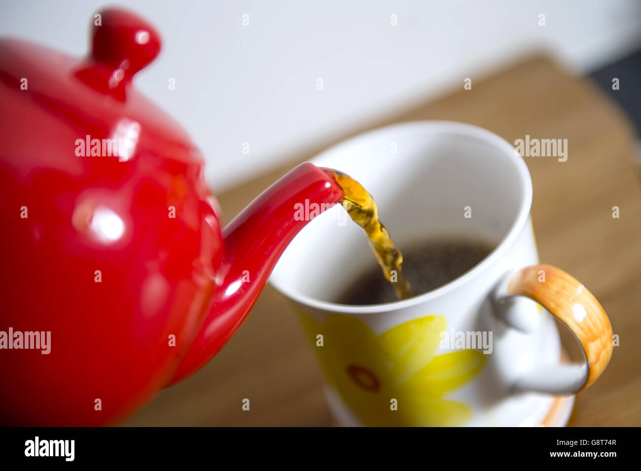 English breakfast tea is poured from a teapot hi-res stock photography ...