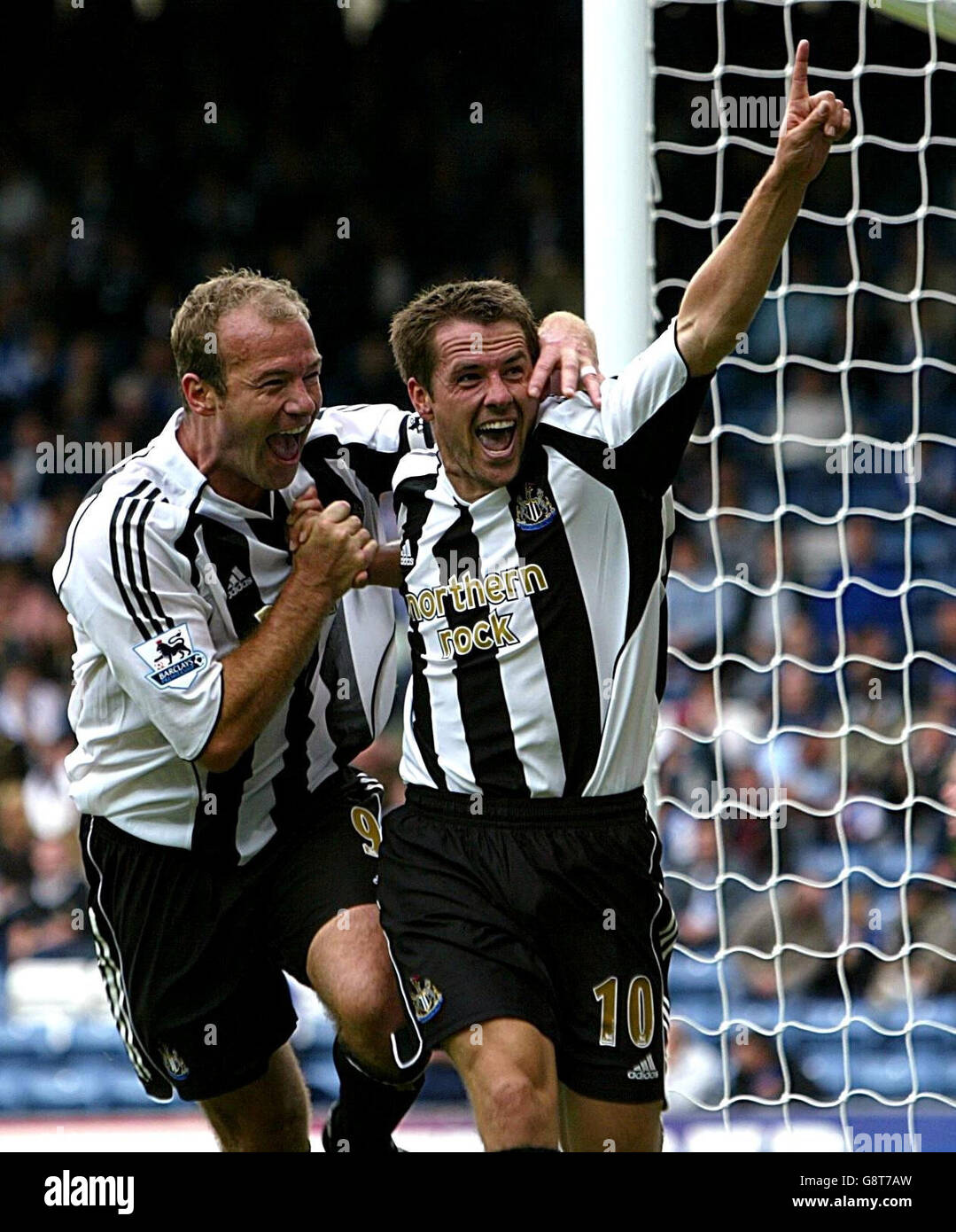 Newcastle United's Michael Owen celebrates with team-mate Alan Shearer ...