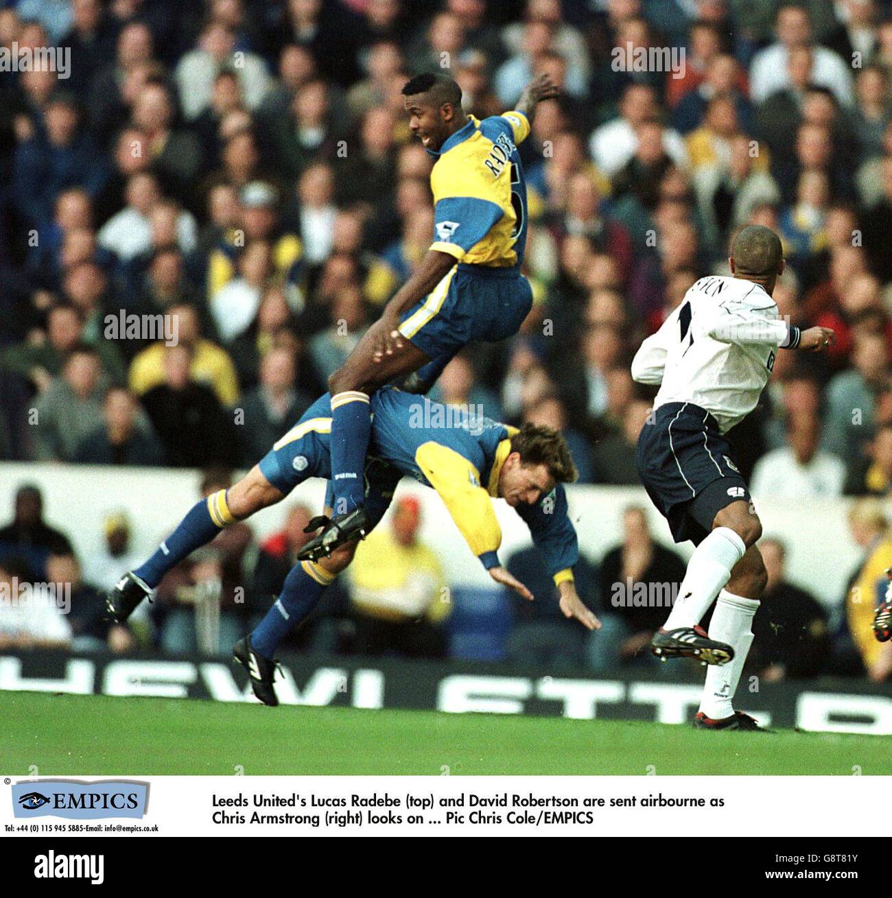 Leeds United's Lucas Radebe (top) and David Robertson (left) collide in ...