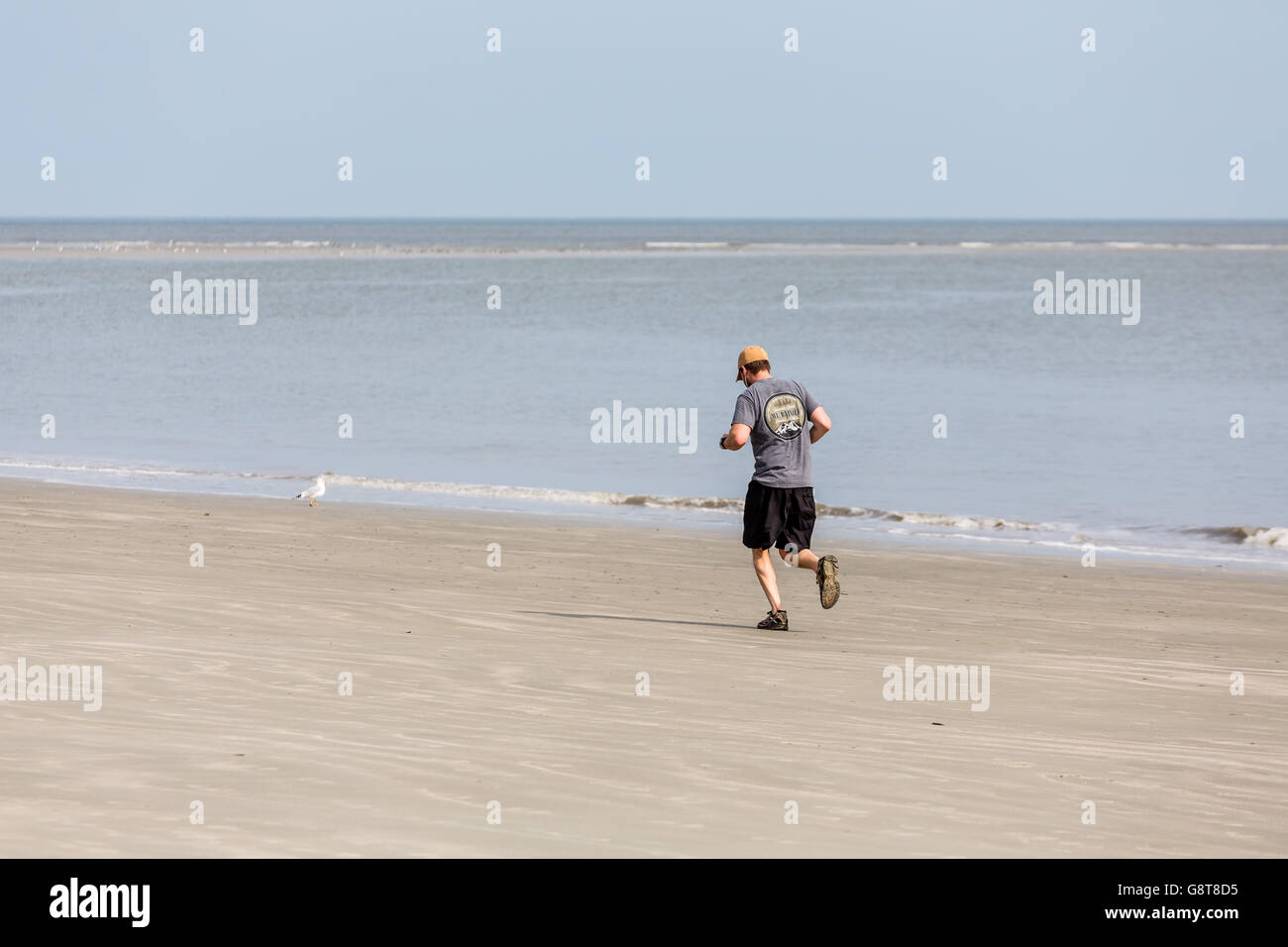 Man jogging on beach hi-res stock photography and images - Alamy