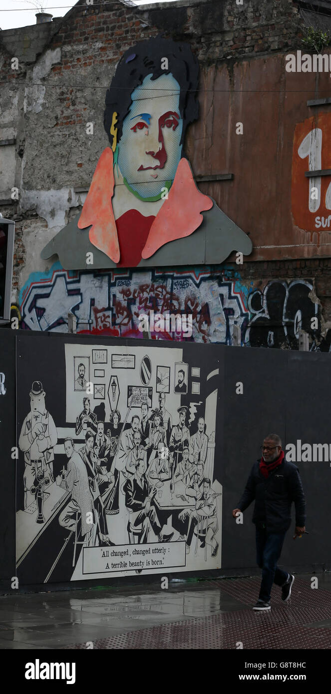 A man passes a mural in central Dublin, where graffiti artists have ...