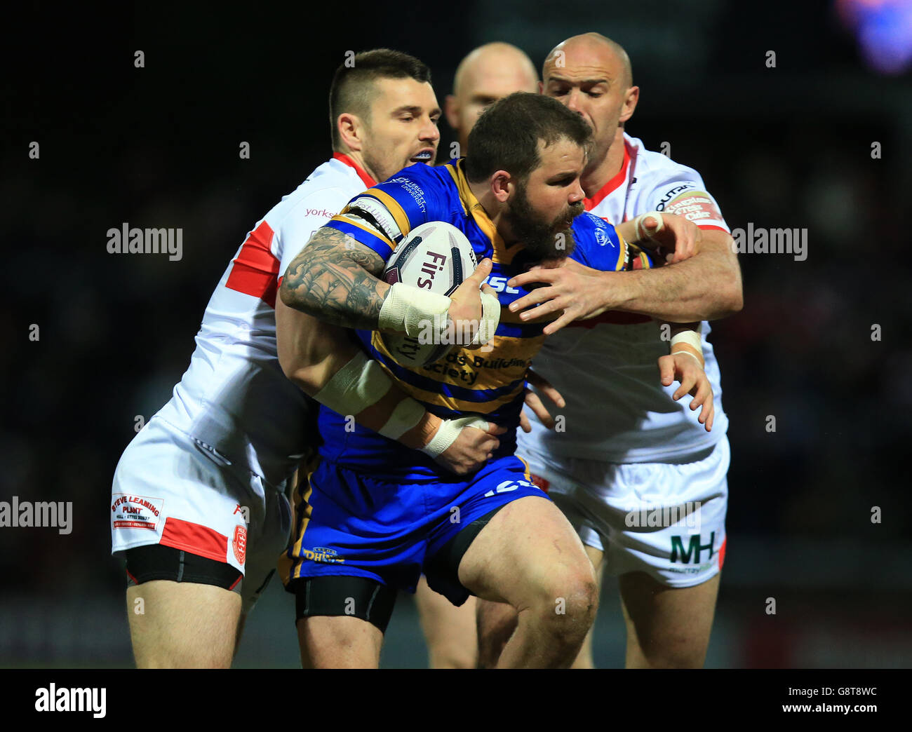 Leeds Rhinos' Adam Cuthbertson and Hull KR's Mitch Allgood and Dane ...