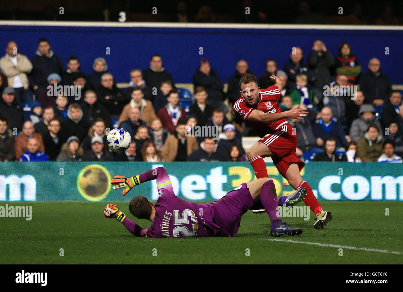 Middlesbrough's Jordan Rhodes (right) see's his shot saved by Queens ...