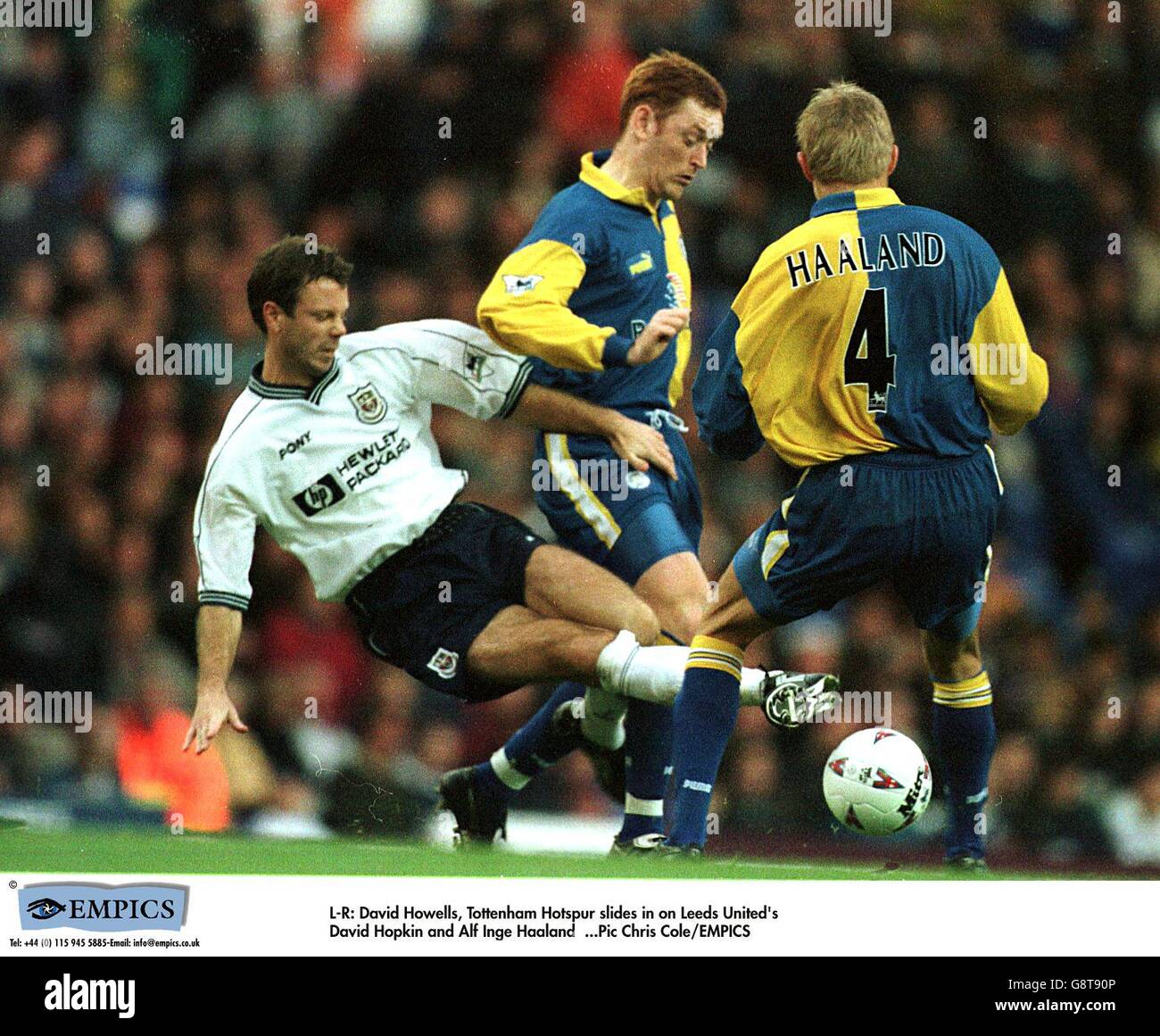 David Howells of Tottenham Hotspur (left) slides in on Leeds United's ...