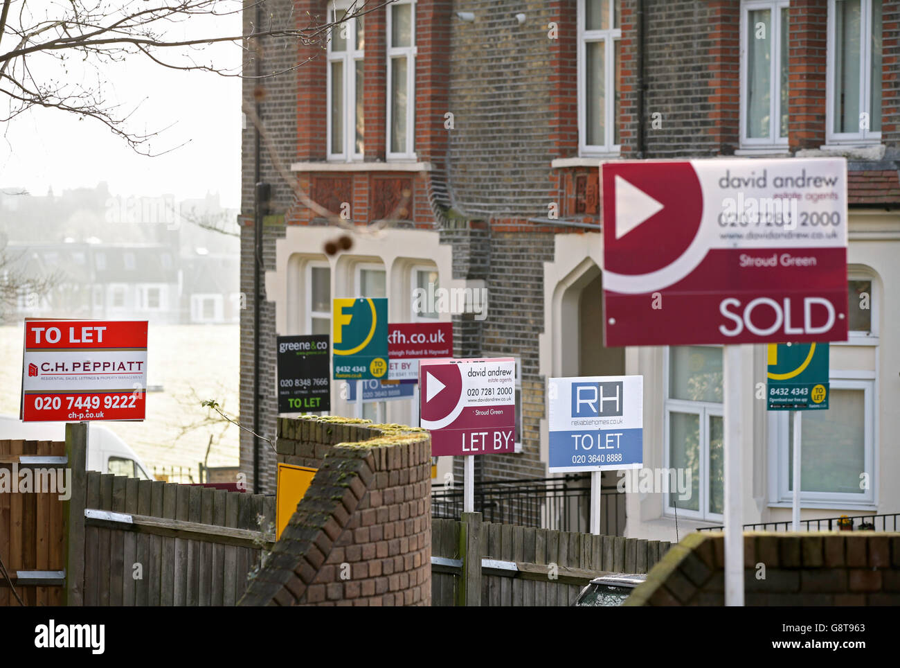 Sold, To Let and Let By estate agent signs placed outside homes in ...