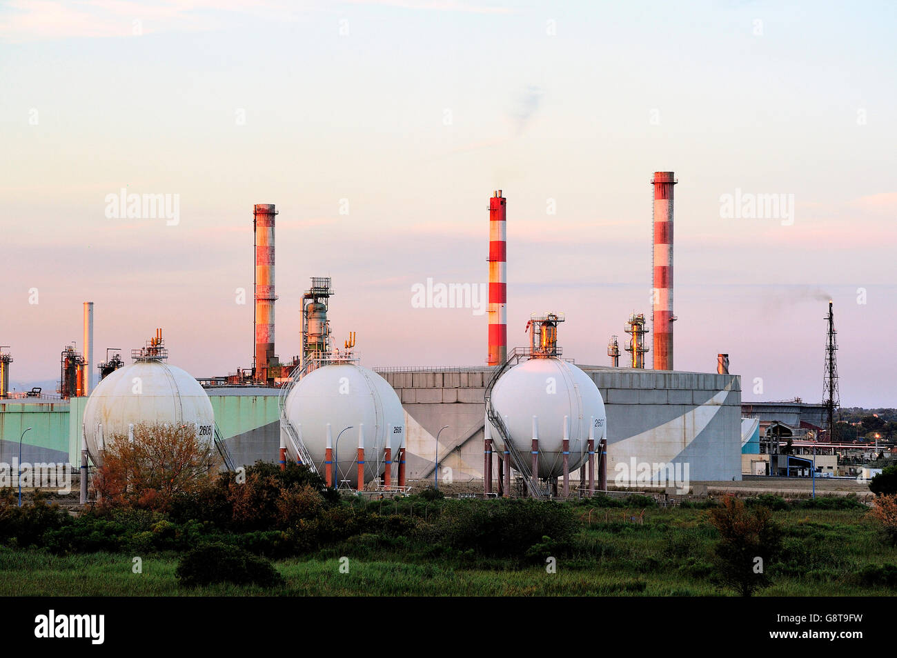French oil refinery in Fos on sea beside Marseille. Tanks of storage ...