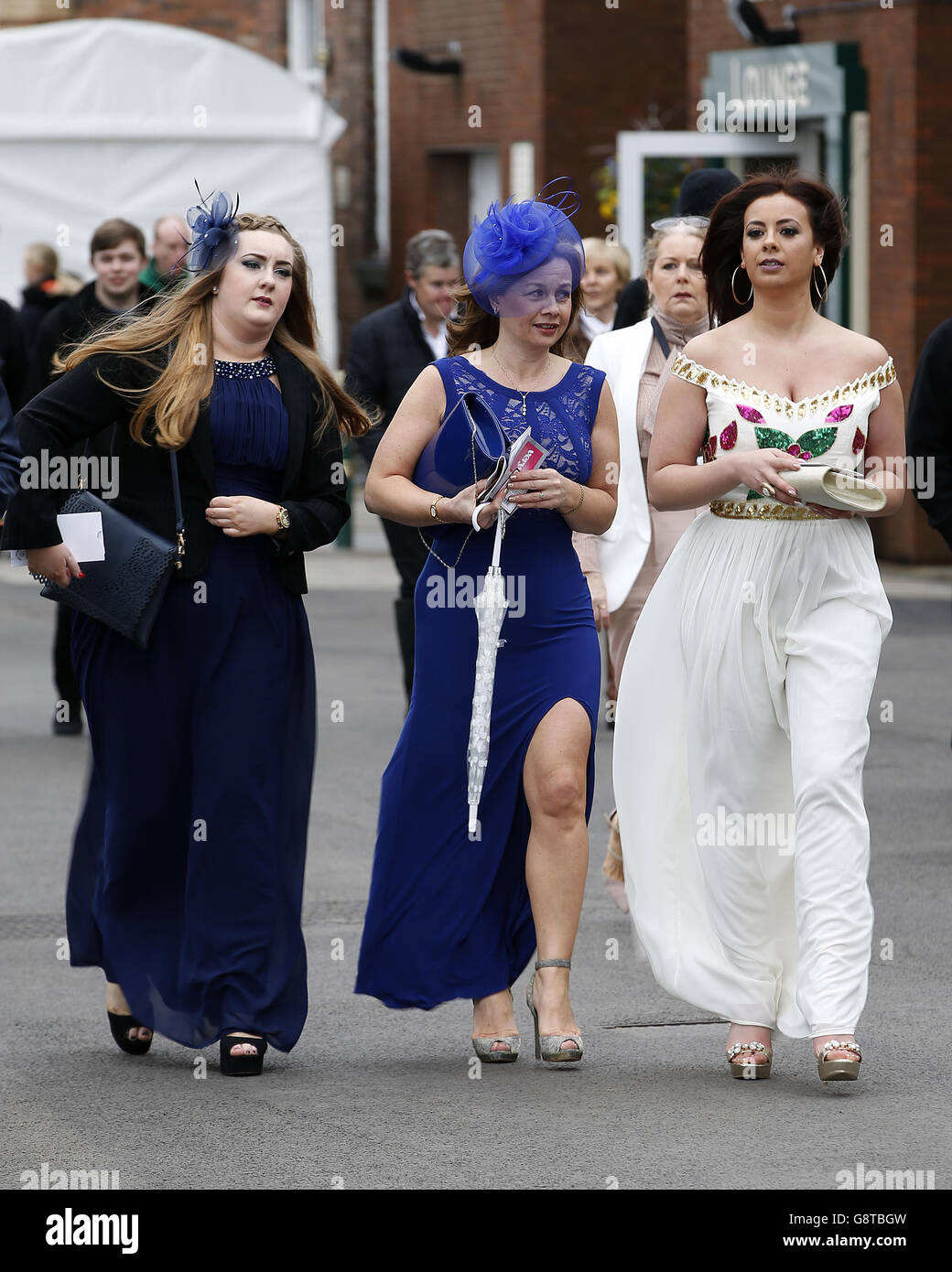 Female racegoers arrive for Ladies Day of the Crabbie's Grand National ...