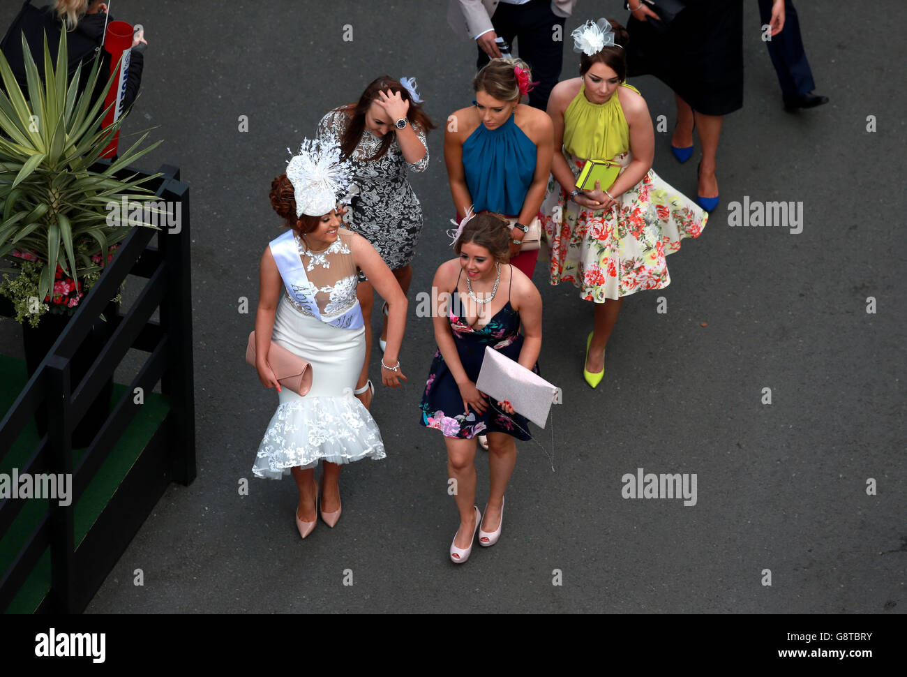 Female racegoers make their way around the course during Ladies Day of ...