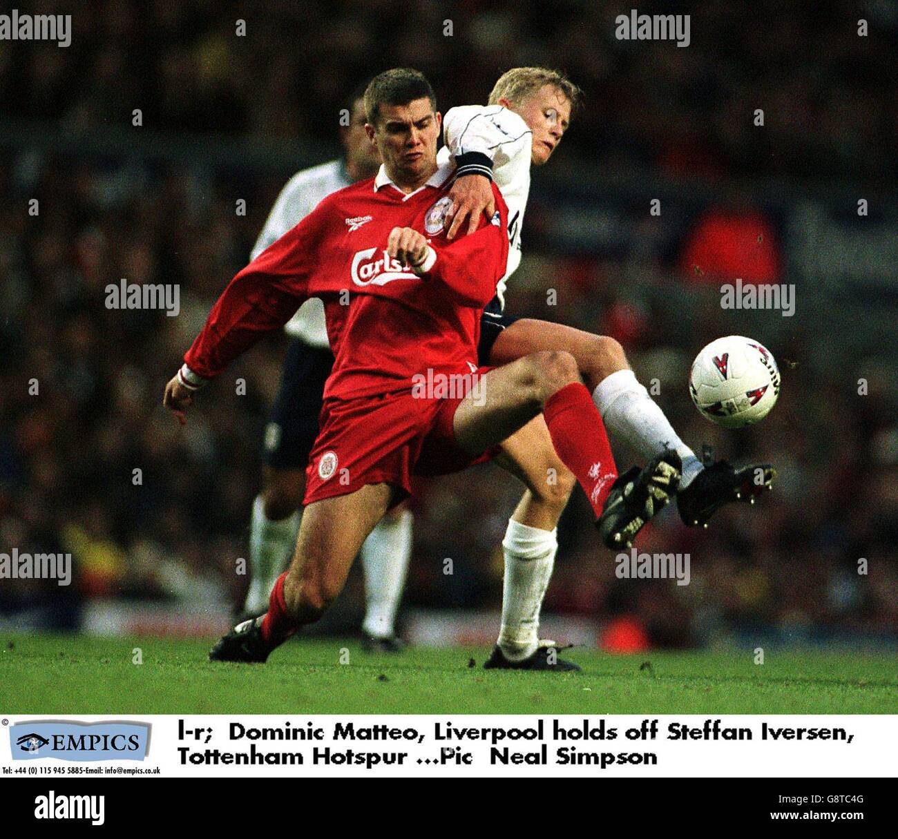 Dominic Matteo of Liverpool (left) stretches for the ball with Steffen ...