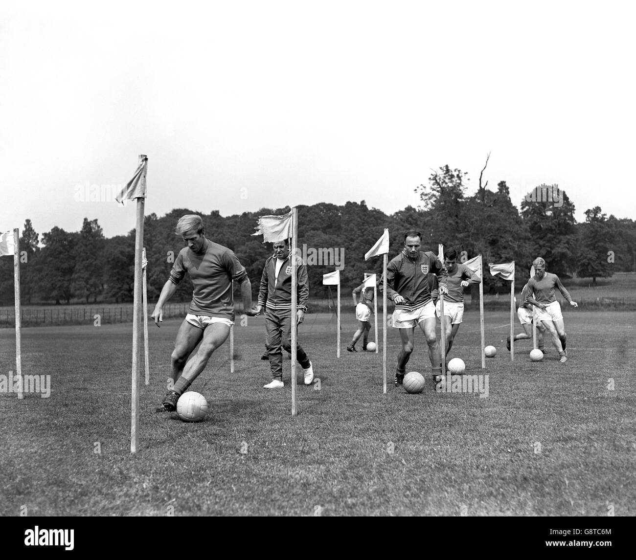 Bobby Charlton leads a dribbling drill during England World Cup ...