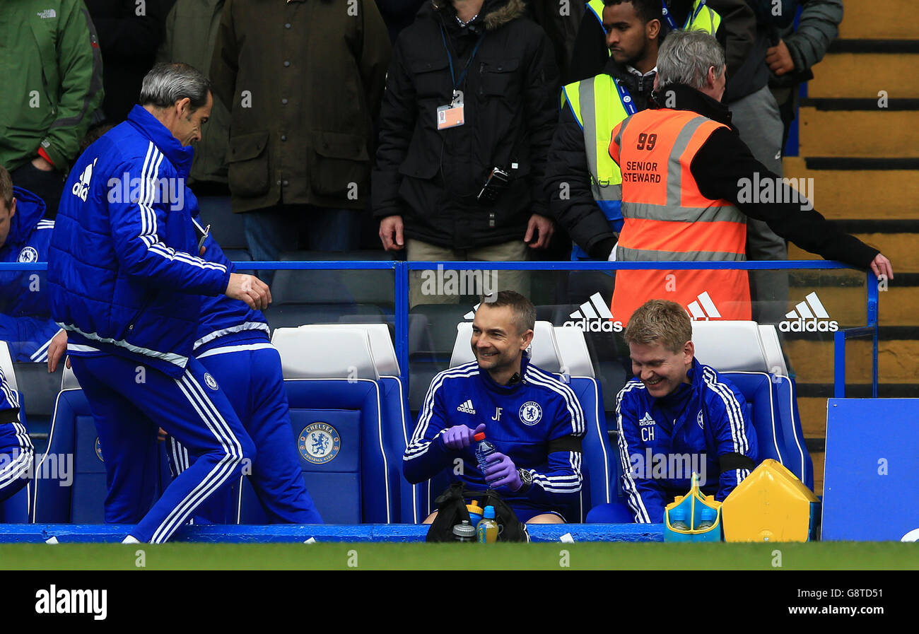 Chelsea physio Jon Fearn (centre right) returns to the bench before the ...