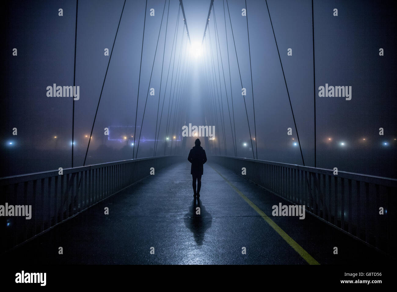 Woman walking at night rear view hi-res stock photography and images ...