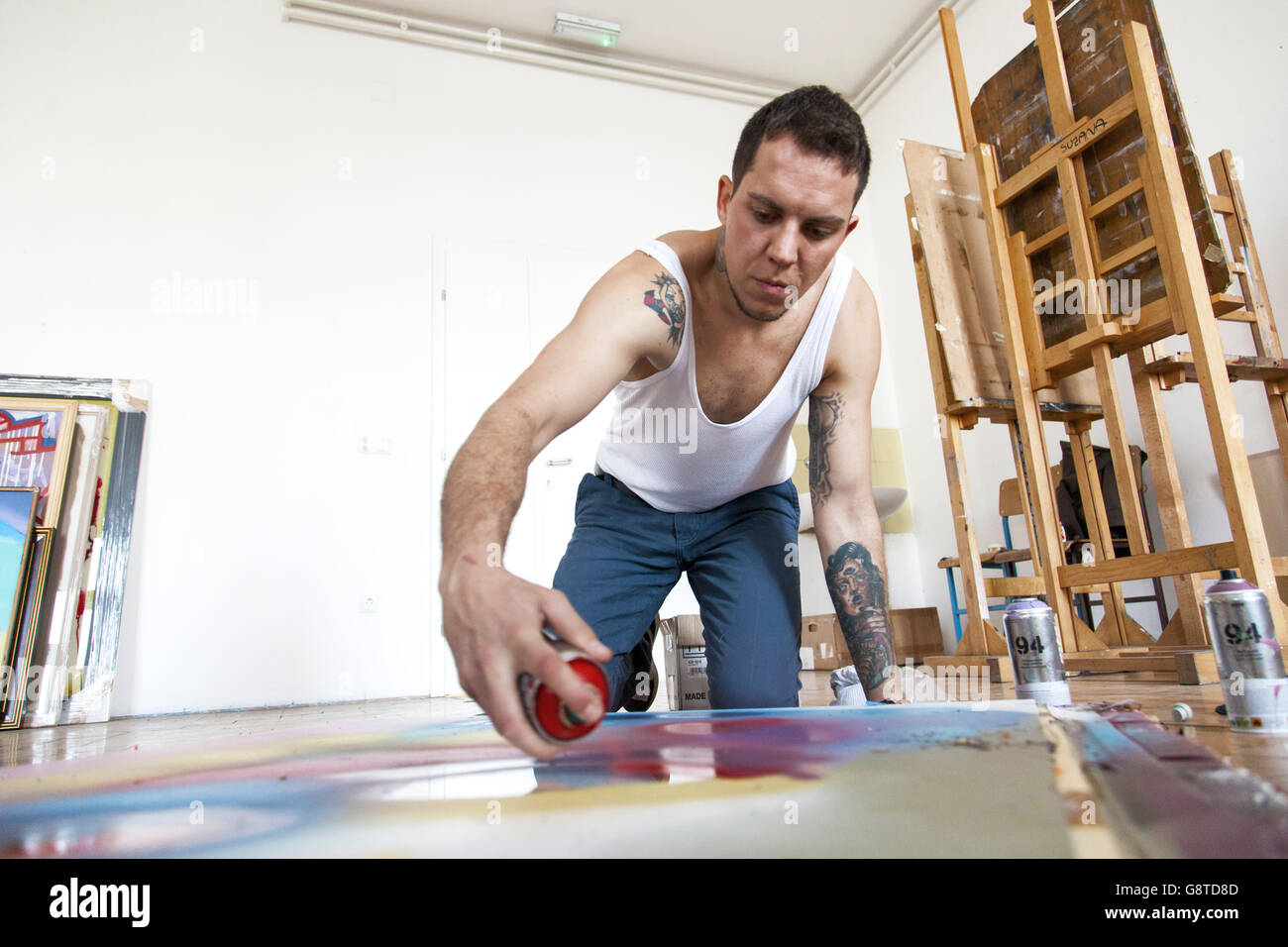 Male painter in his studio creating painted art work Stock Photo - Alamy