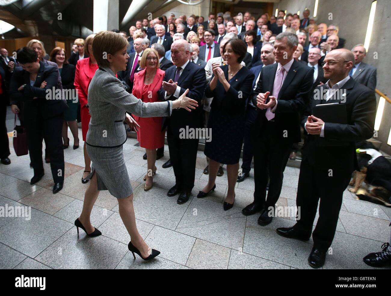 First Minister Nicola Sturgeon puts her hand out to shake hands with ...