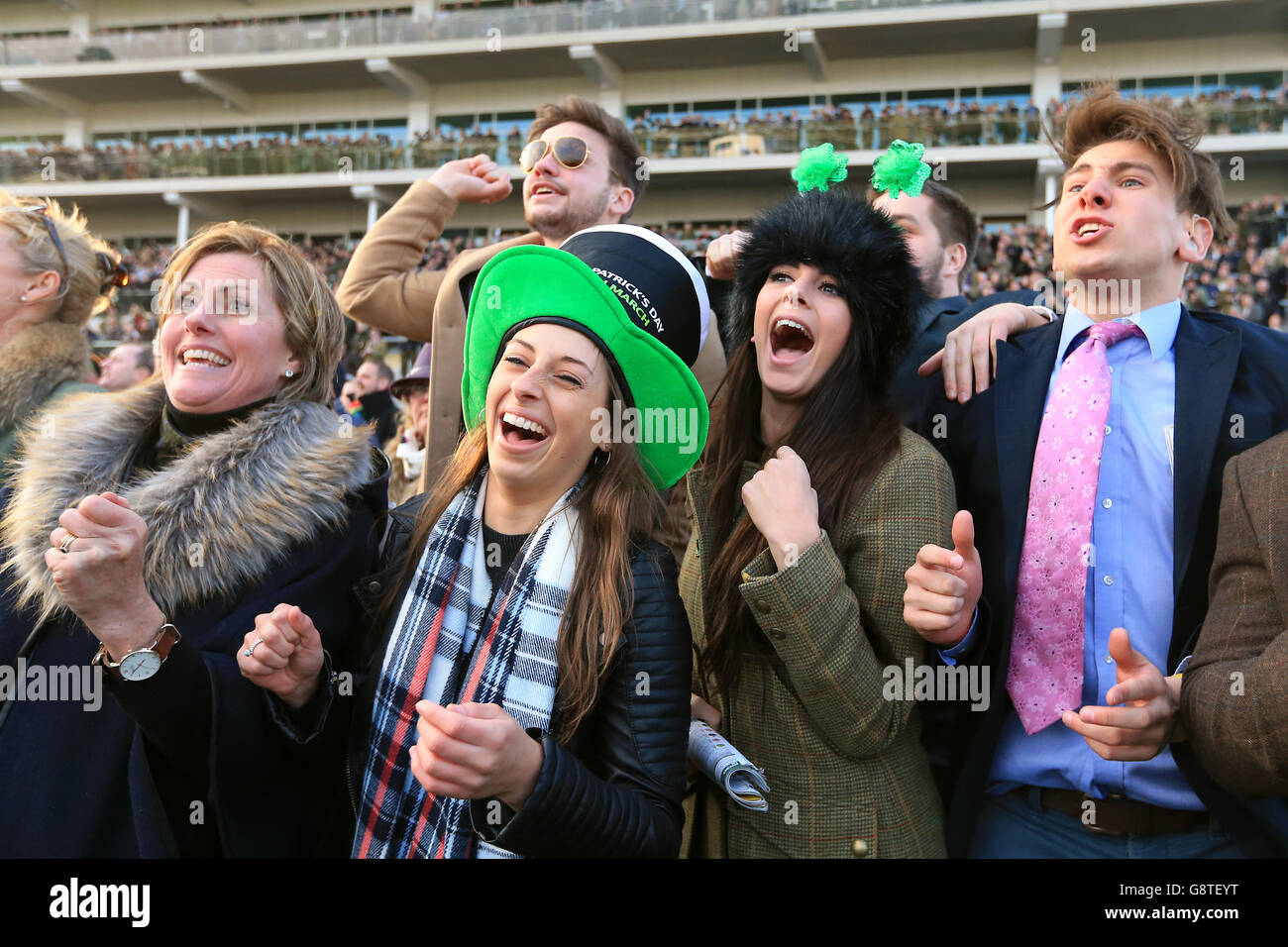 Racegoers cheer on the horses during the Trull House Stud Mares ...